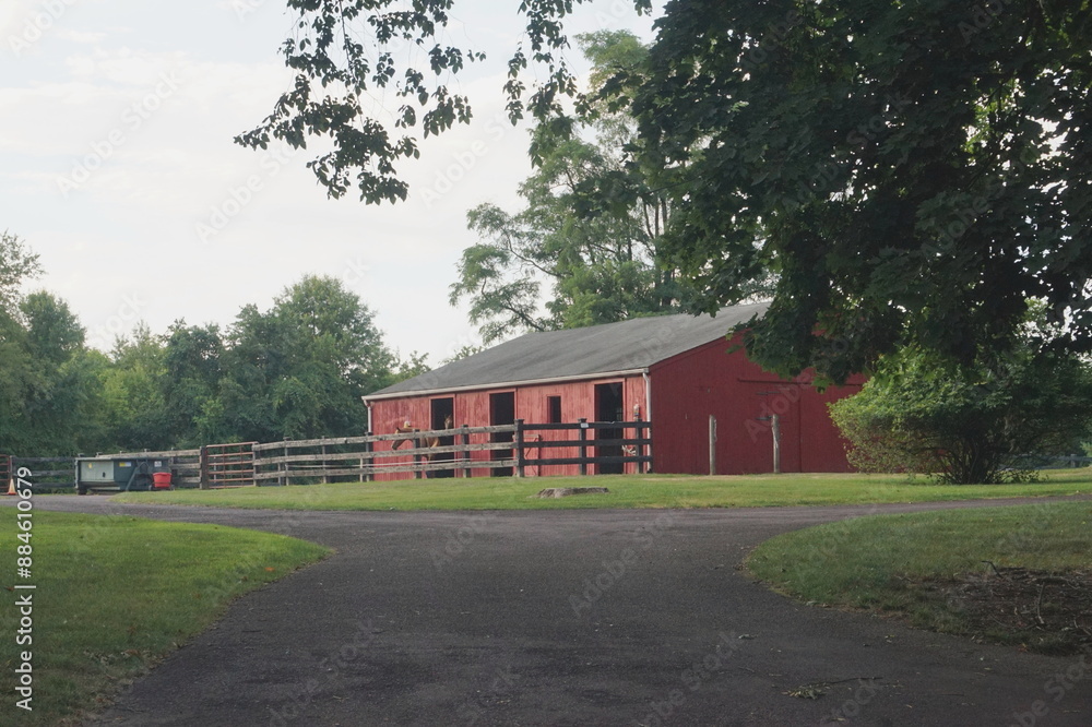 Red Horse Barn with Rustic Fencing, Green Grass, Tree and Sky Stock ...