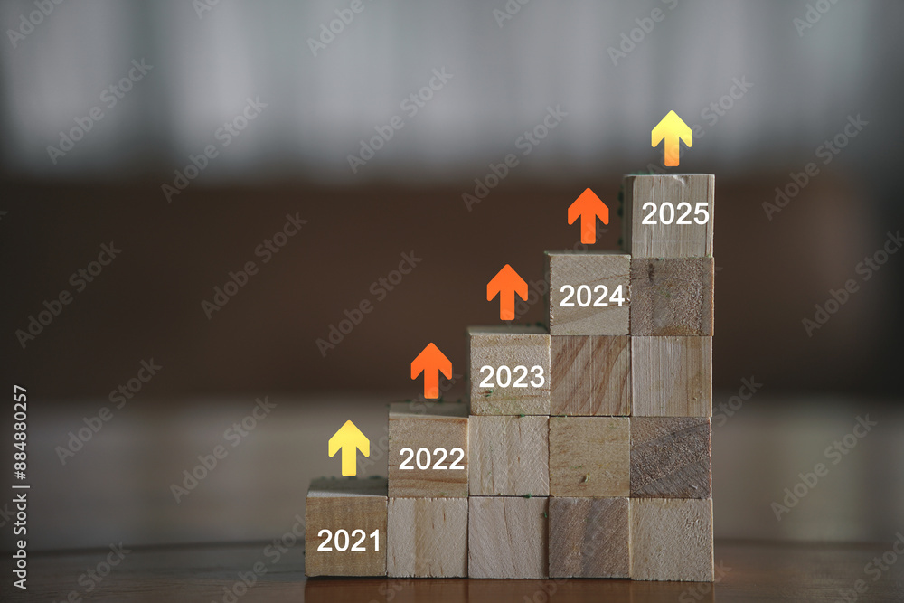 Starting new year 2025. Flipping of 2024 to 2025 on wooden cube blocks ...
