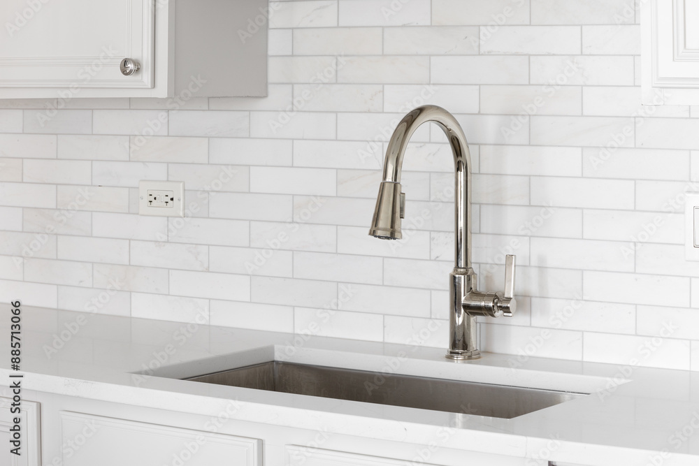 Kitchen sink detail shot with a marble subway tile backsplash, granite ...