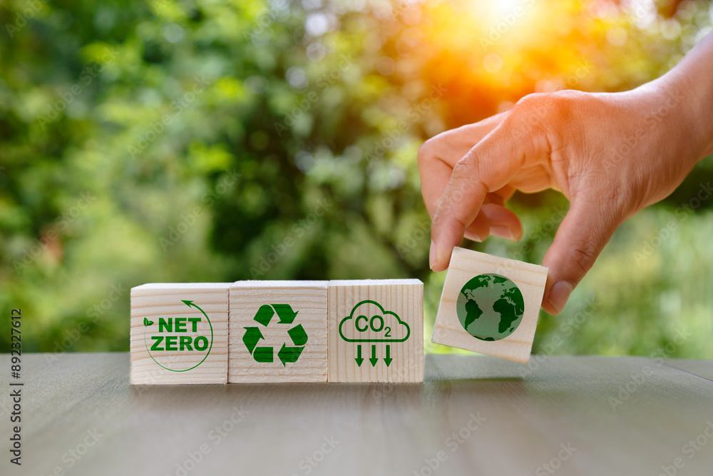 energy renewable, net zero icon at wood box on wood floor at green ...