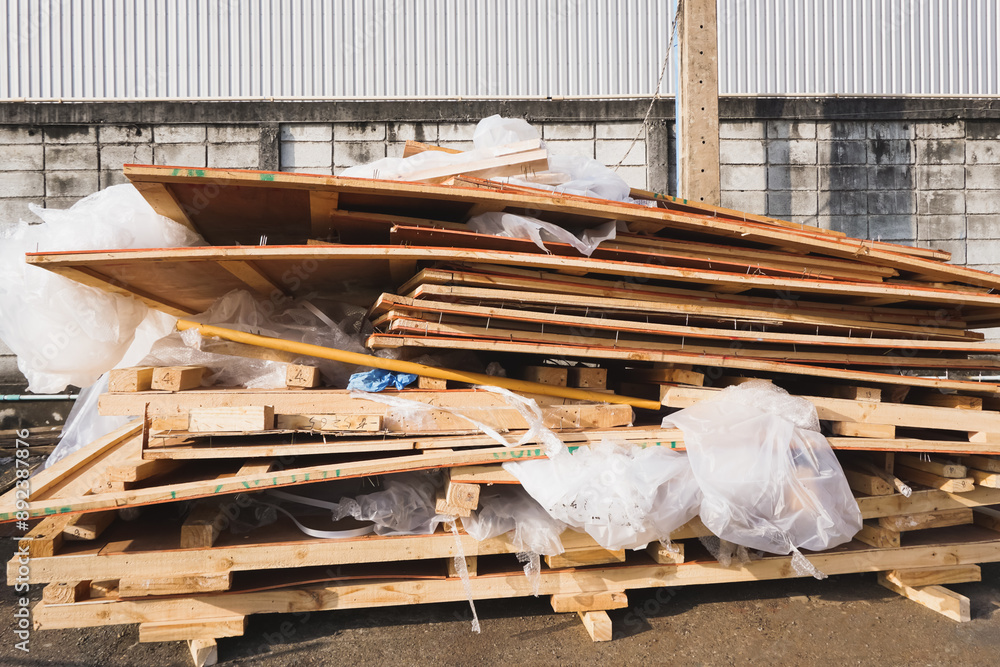 Wooden crates hold products that have been taken apart and stacked. A ...