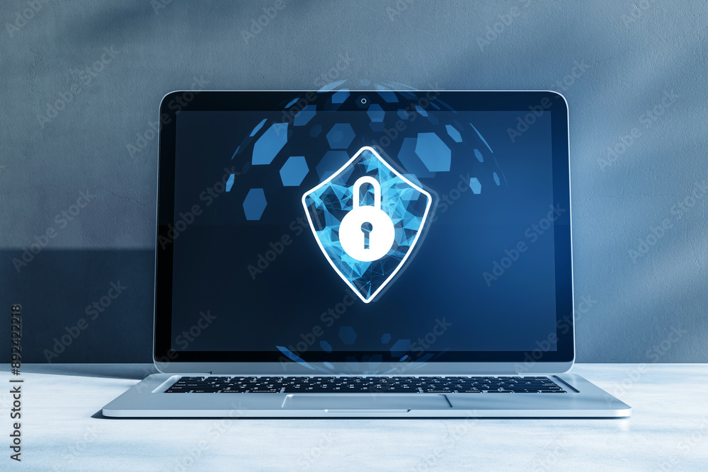 Laptop with hologram lock icon on screen for cybersecurity protection ...