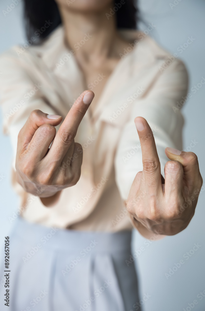 Rude and Impolite gesture concept image, Hand of Asian woman flipping up double middle fingers ...