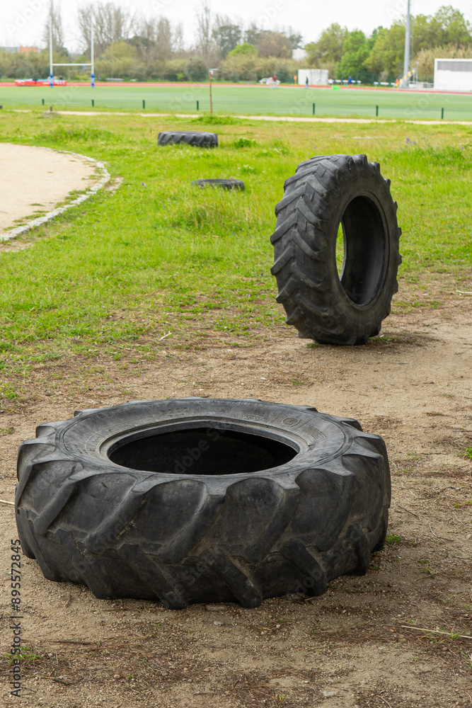 Large tractor tires set up in a sports complex for obstacle courses or ...