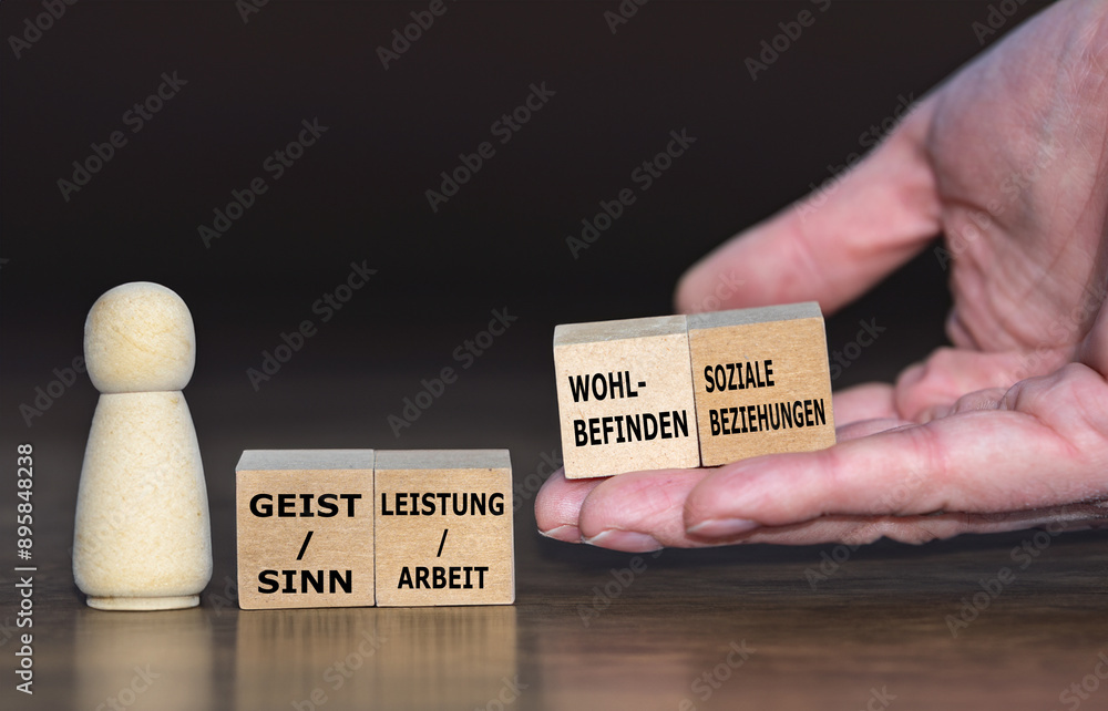 Wooden cubes form the German expressions 'Geist,Leistung Arbeit ...