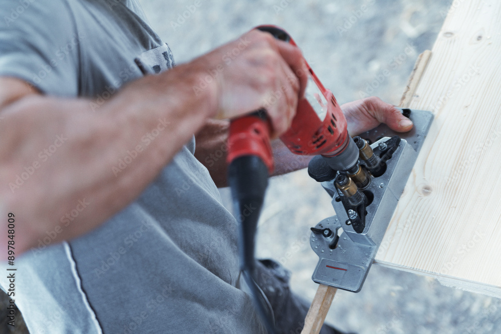 Carpenter using a pocket hole jig to join wood Stock Photo | Adobe Stock