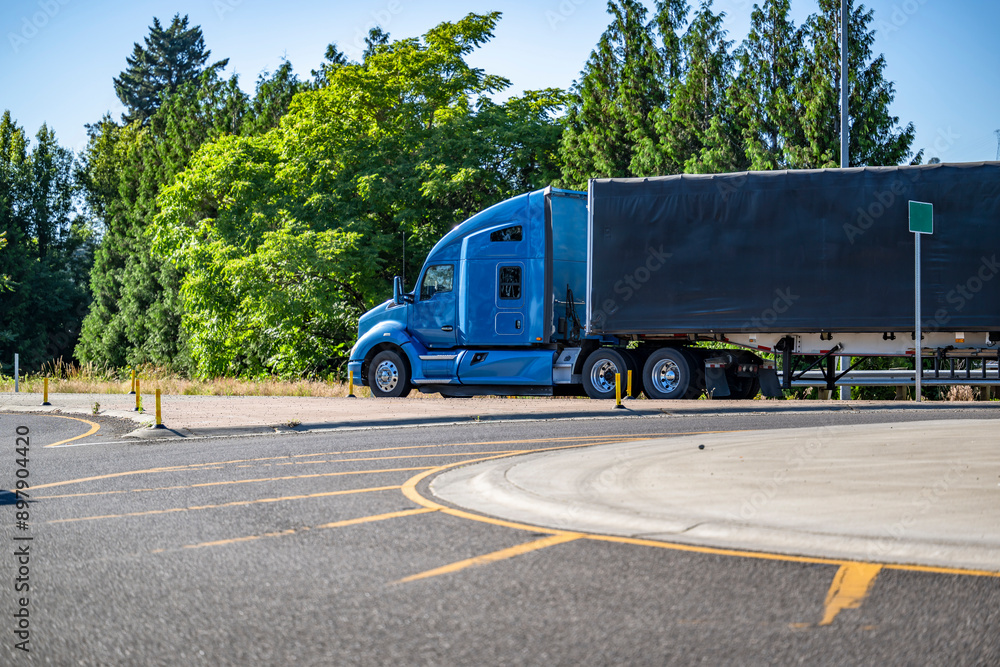 Blue long hauler big rig semi truck tractor transporting cargo in ...