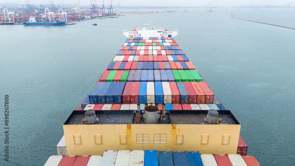 stern of Cargo container ship carrying container and running in ...