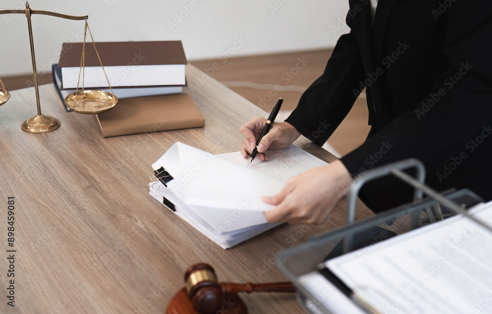 Professional Female Lawyer Reviewing Legal Contract Documents in Modern ...