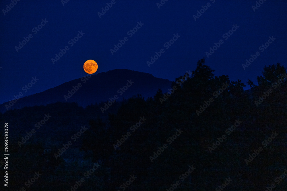 The full flower moon - 07, 2024. The rising moon over the mountain ...
