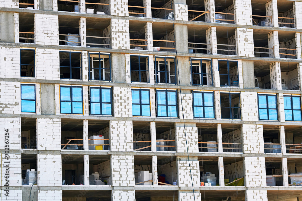 Windows installation on facade of new building. Building under ...