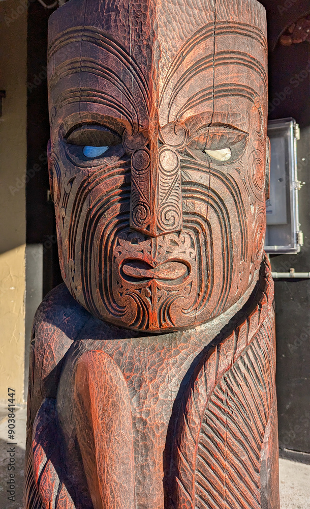 Beautiful Maori pou carved wooden statue in capital city of Wellington ...