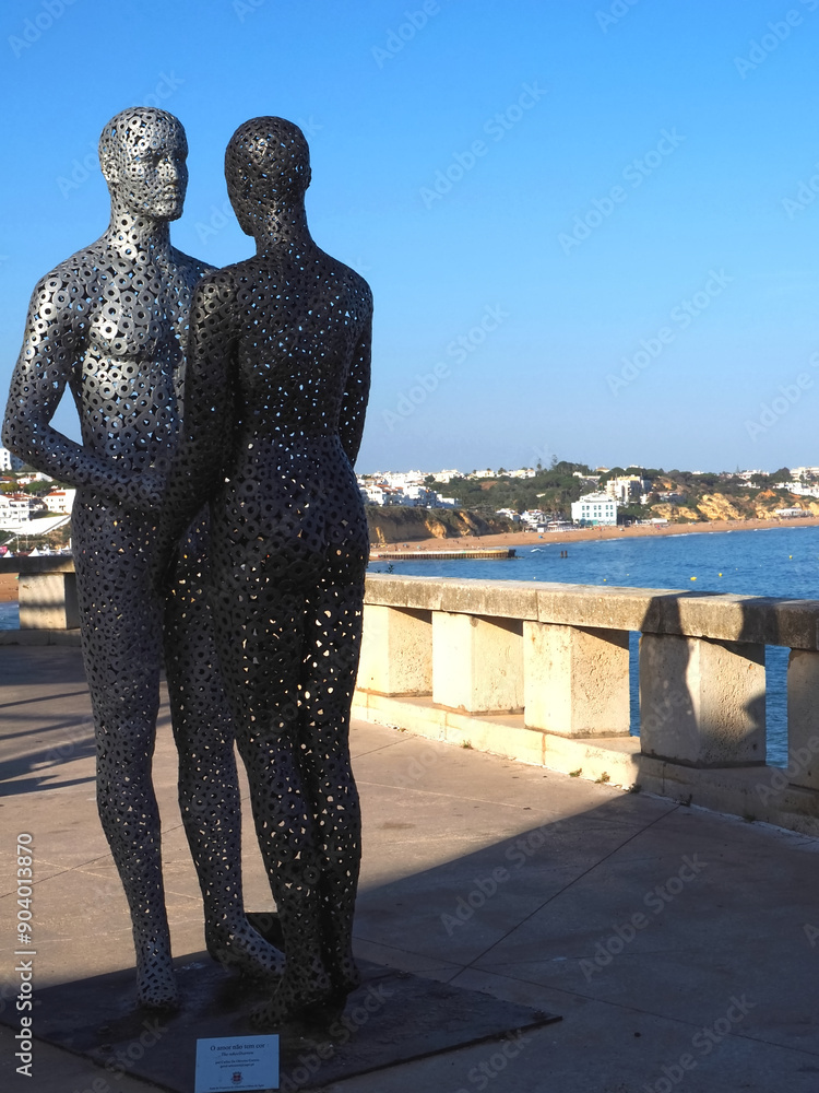 Sculptures of a white man and a black woman about racial discrimination ...
