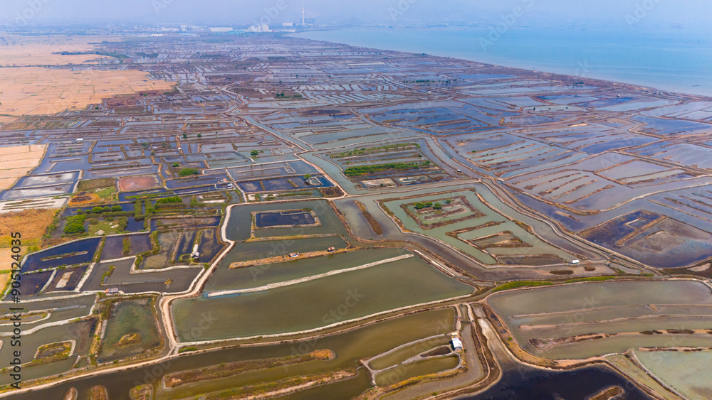 Aerial view of a sprawling aquaculture farm with an intricate network ...