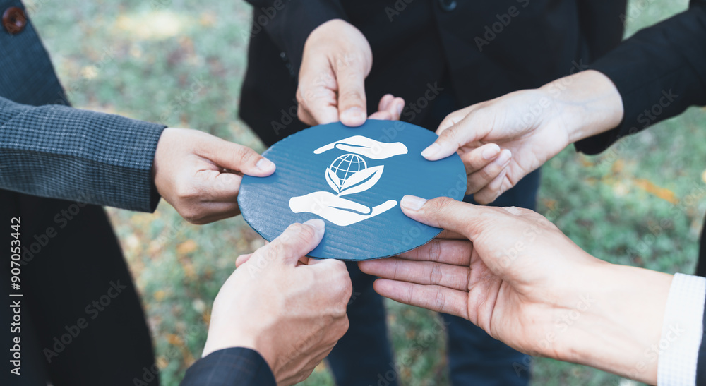 Business people holding ECO friendly idea symbol together as group of ...