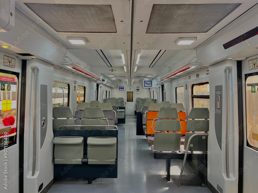 Empty cabin of a modern passenger train. Empty seats inside train cabin ...