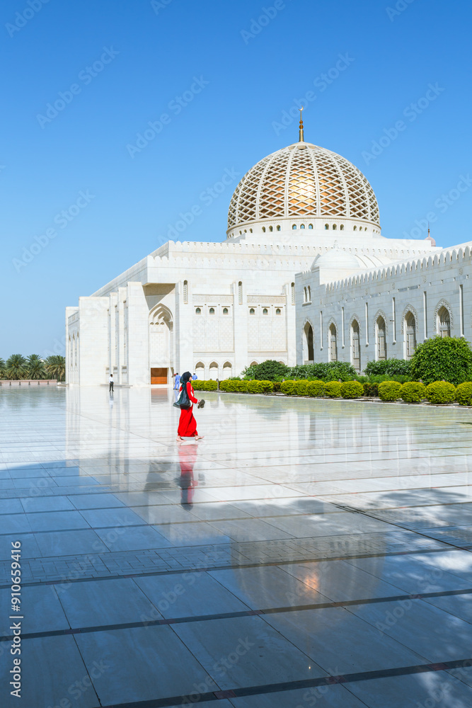 Woman walking outside Sultan Qaboos Grand Mosque, Muscat, Oman Stock ...