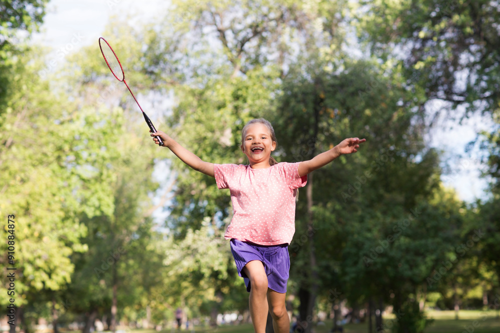 joyful little girls playing badminton, having fun in the park on sunny ...