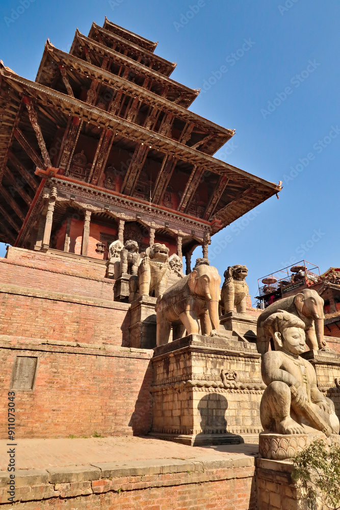 Two rows of big stone statues, sculptures, guardians line up next to ...