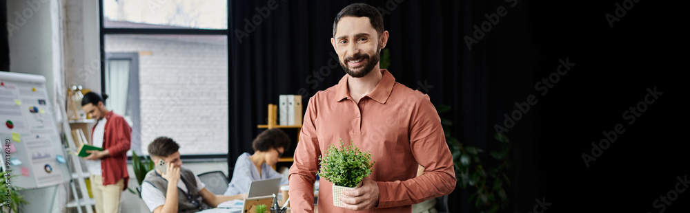Professional man packing his belongings during lay off in modern office ...