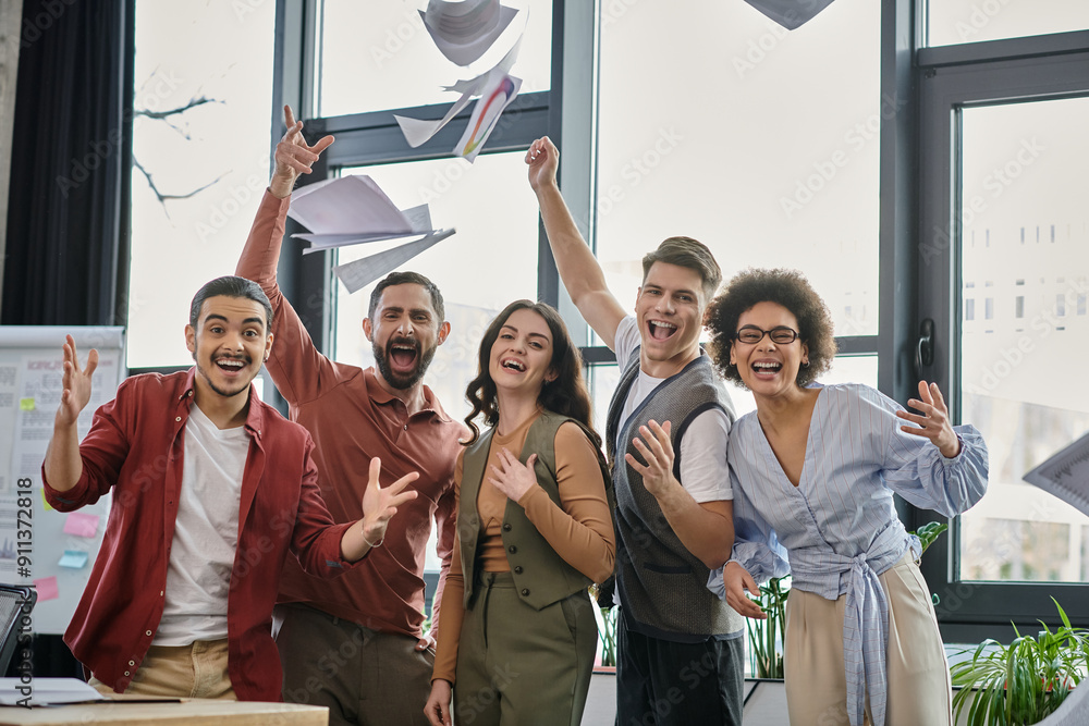 Team members joyfully embrace change while expressing hope in a bright ...