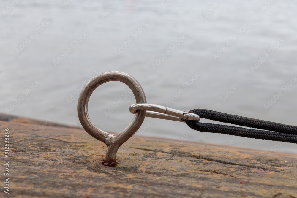 Mooring ring for boats in the stone with carbine and black rope from ...