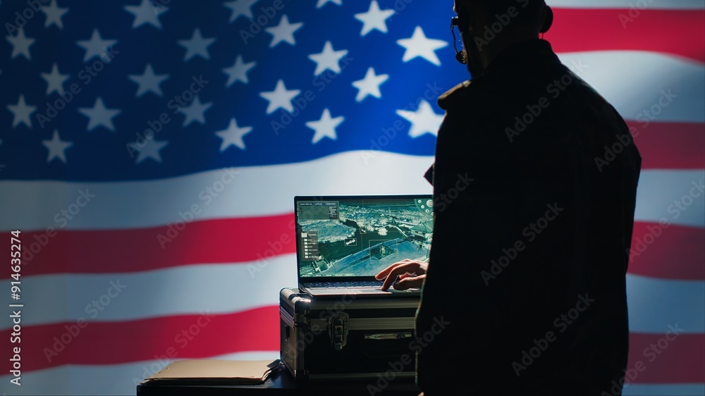 US Air Force agent using radar system on laptop to detect incoming ...