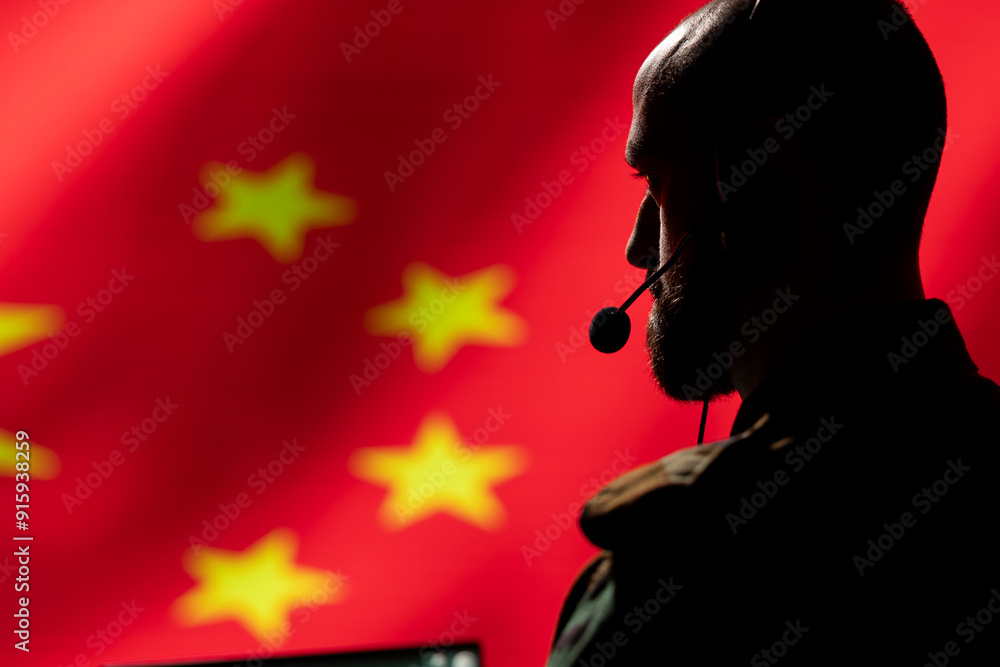 Military dispatcher providing informations for troops on war front lines, talking in headset ...