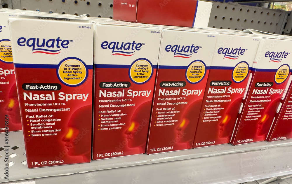 Equate brand of Nasal Spray bottles on a shelf of a Walmart store. の ...