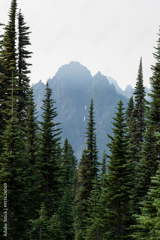 Smoke smog air pollution from wildfires hanging over rocky peaks of the ...