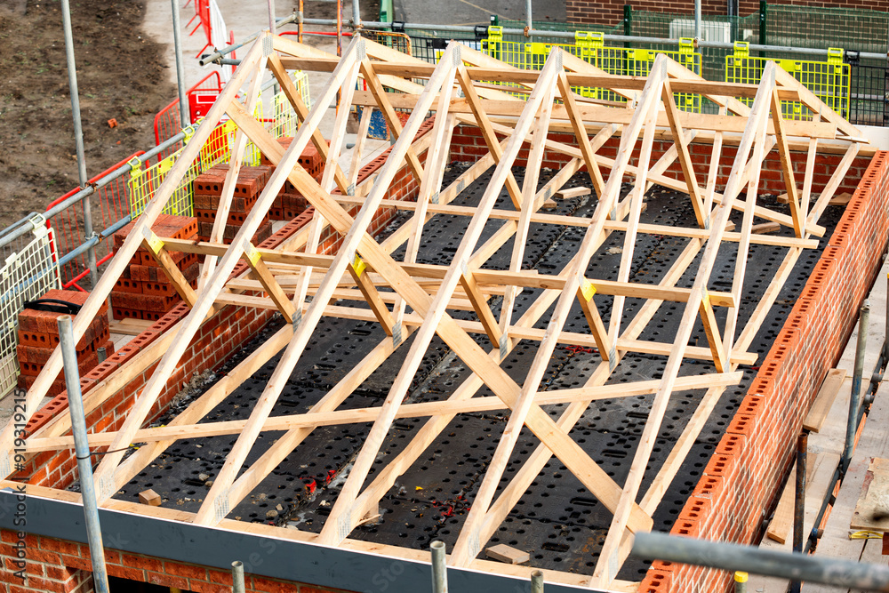 Wooden framework for new roof under construction at residential ...