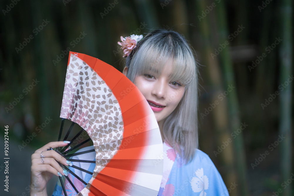 Pretty girl in a Yukata dress. A young Asian woman wearing a ...