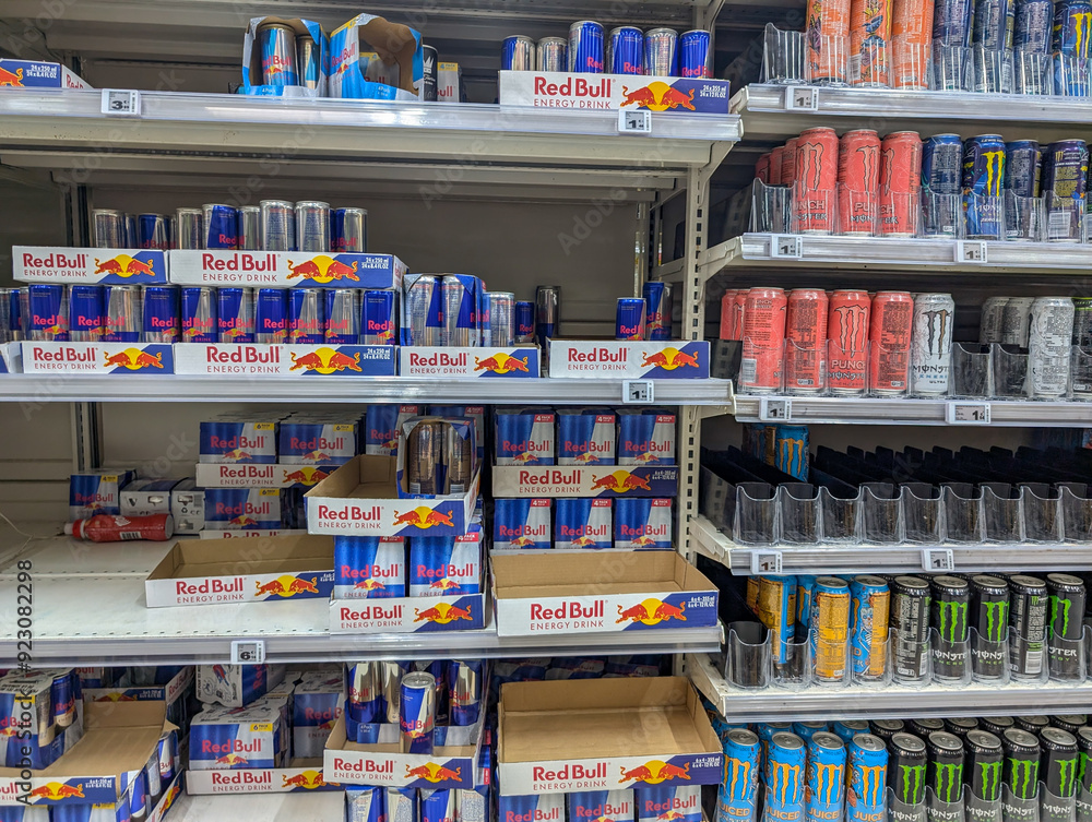 France, 10 August 2024: Shelves stocked with energy drinks including ...