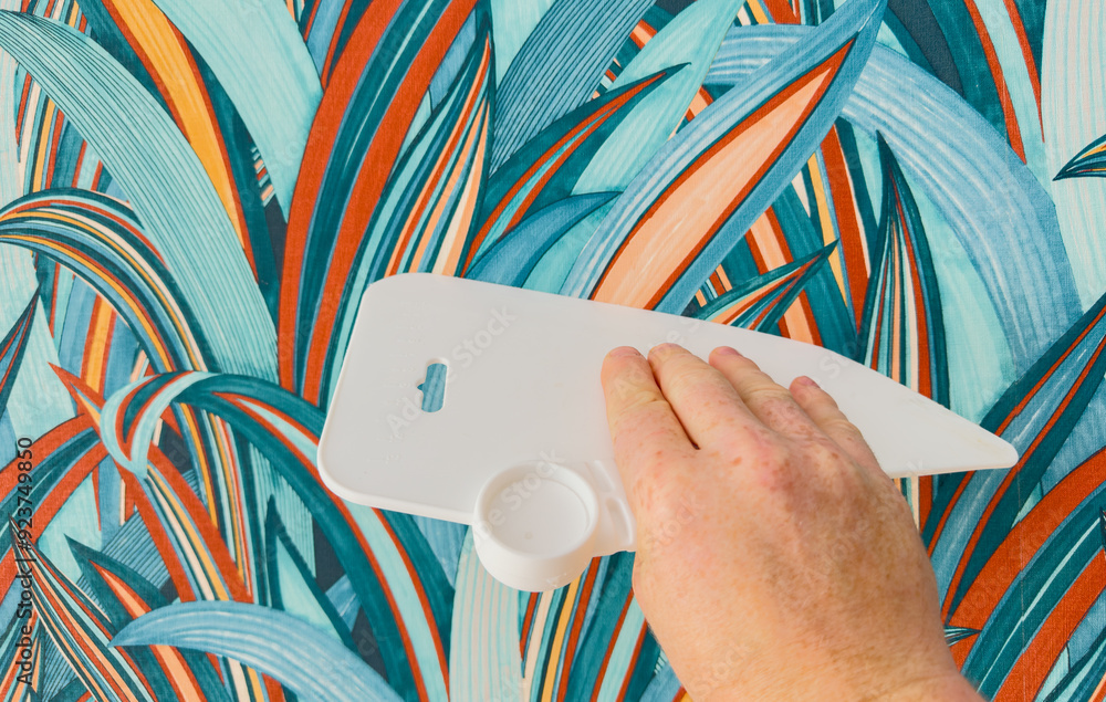 Wallpapering. Professional Wallpaper Hanging in room of flat. Pasting ...