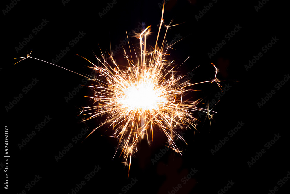 Sparklers on black isolated background. Sparks from a burning sparkler ...
