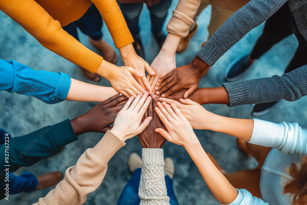 Diverse hands in circle signify unity, teamwork, and partnership ...