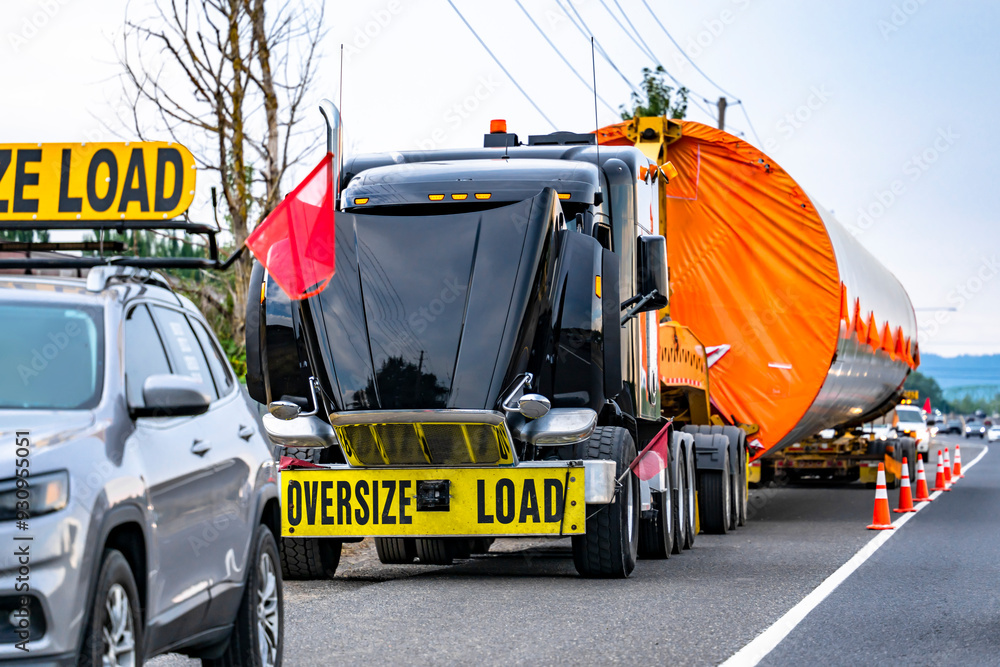 Black broken big rig semi truck with open hood and oversize load ...