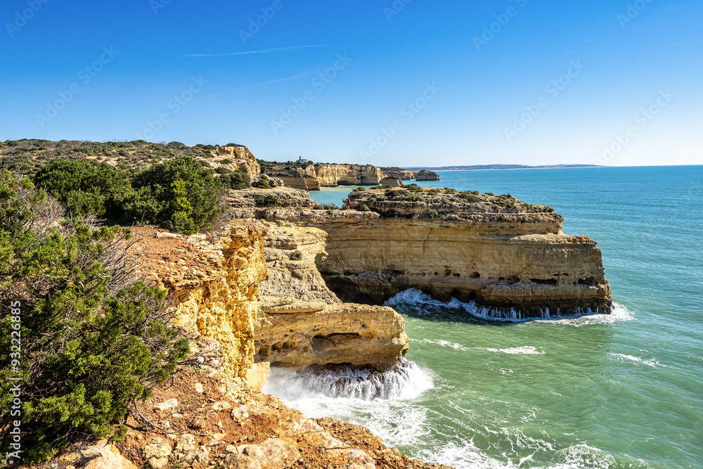Praia da Marinha Beach among rock islets and cliffs seen from Seven ...