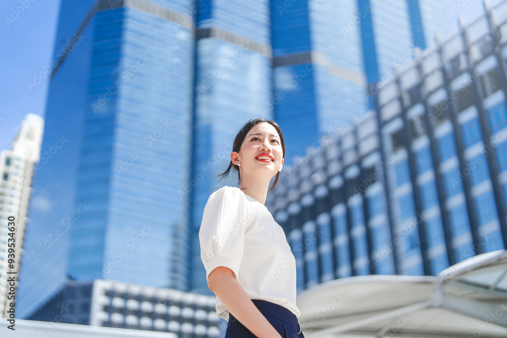 Portrait of successful business asian woman standing looking forward at ...