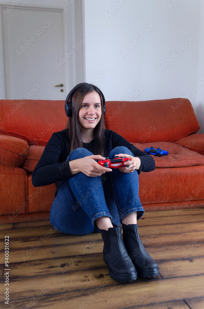 Gamer girl having fun with video game console, headphones and red ...