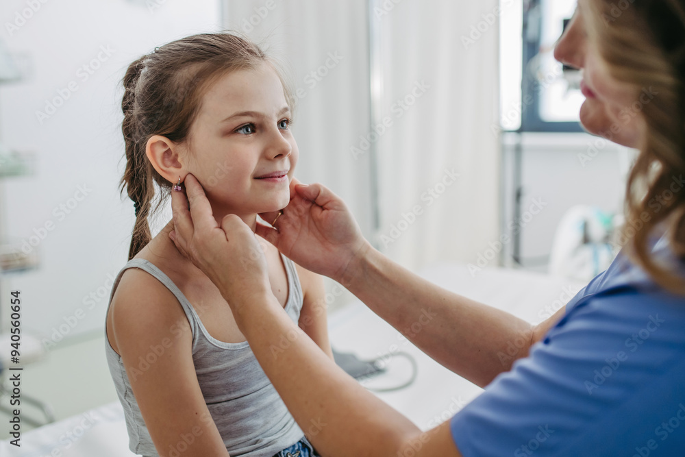 Doctor examining lymp nodes on neck of the young girl. Palpation of ...