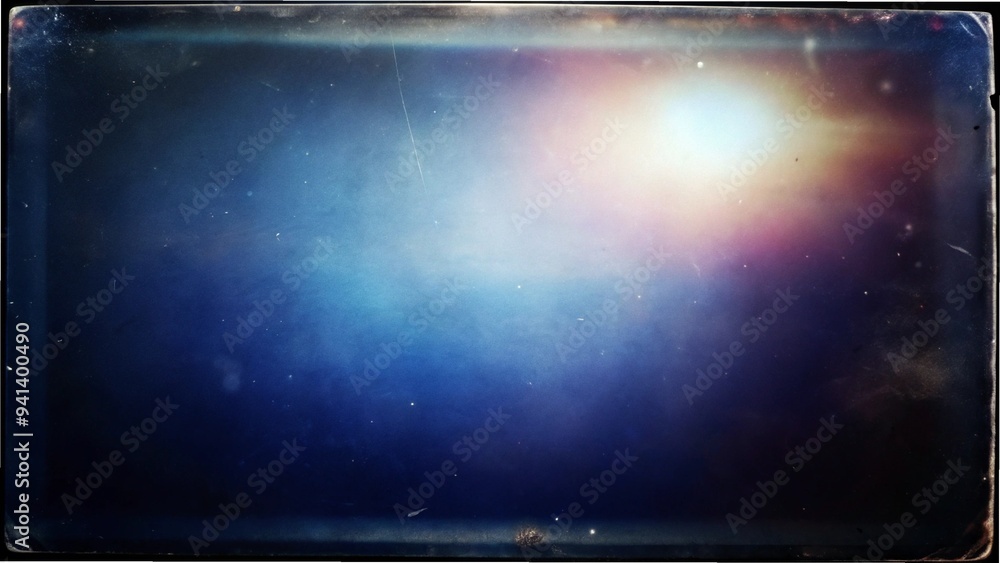 Vintage film camera against a blue sky, sun shining, with distressed ...