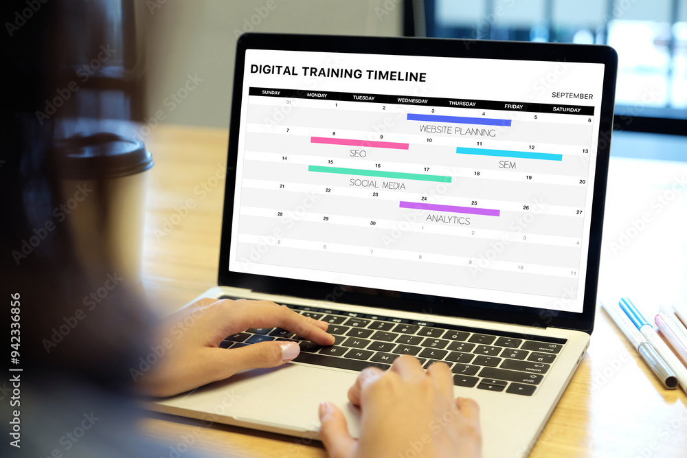 Woman hands typing laptop computer with digital trainting timeline ...