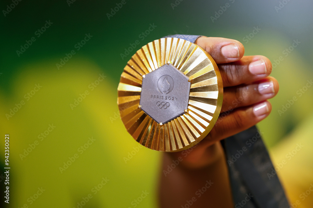 Gold medal of Paris 2024 Olympic Games handheld detail shot, sports ...