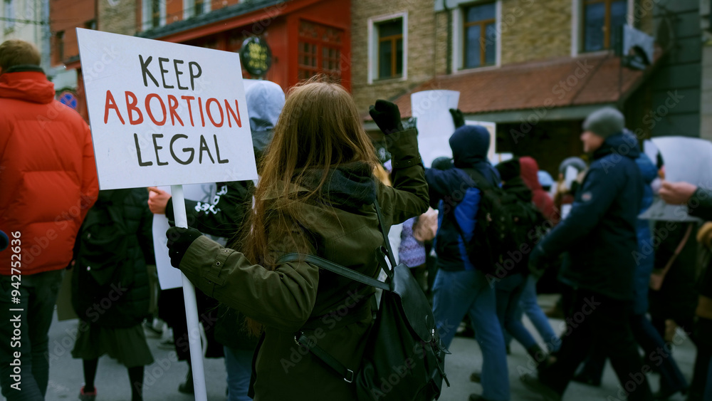 Feminist demonstration city street. Legal abortion protest. Girl hold ...