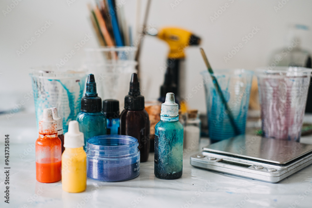 Colorful resin pigments and tools on a worktable, DIY art supplies ...