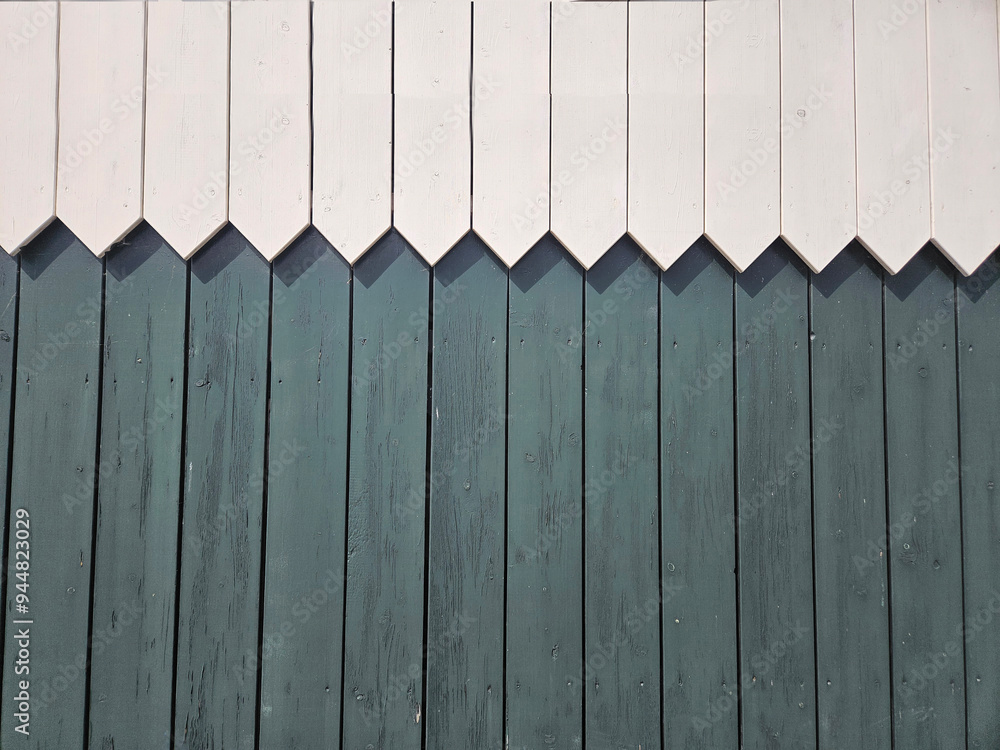 Background image of parallel fence boards painted with dark green paint ...