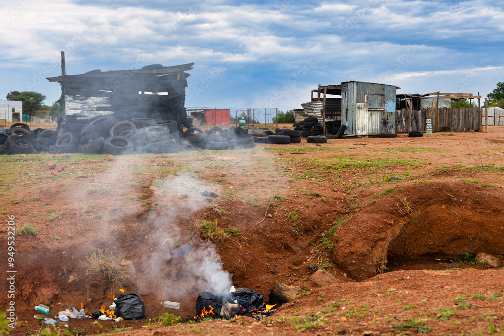 ditch and garbage in the shanty town , shack made of corrugated sheet ...