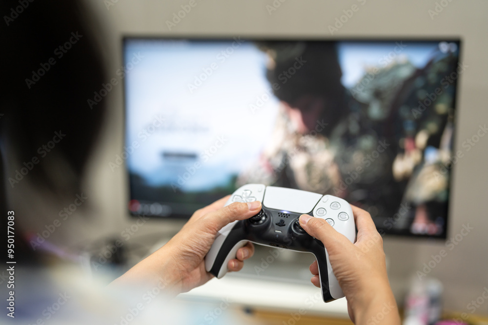 Bangkok, Thailand - 30 Aug 2024: A gamer is controlling on PlayStation ...