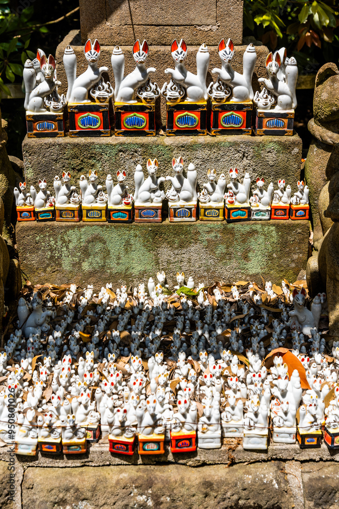Statues of foxes at Jozan Inari Jinja, a Shinto shrine famous for Inari ...
